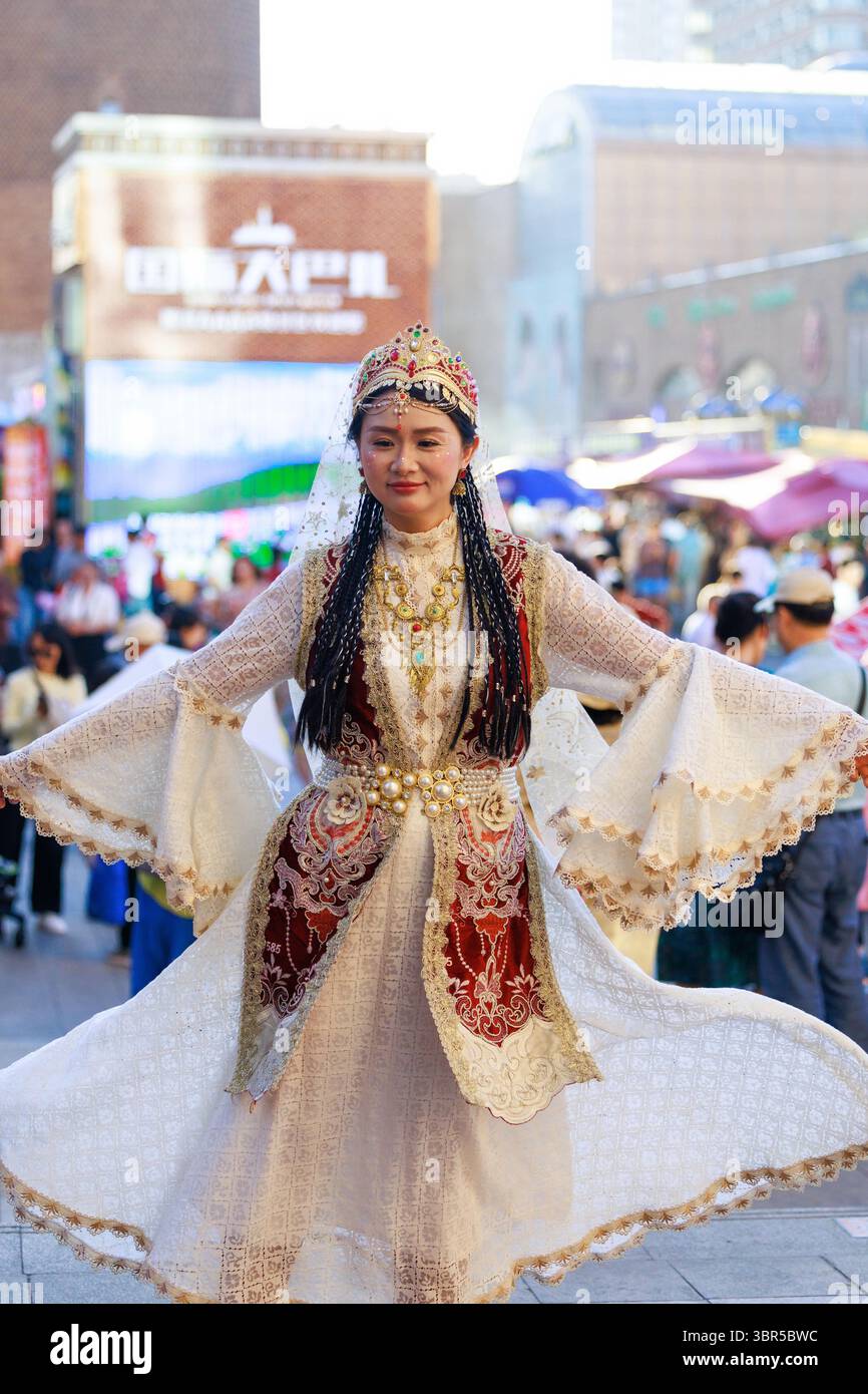 Tourists visit the Grand Bazaar in Urumqi City, northwest China's ...