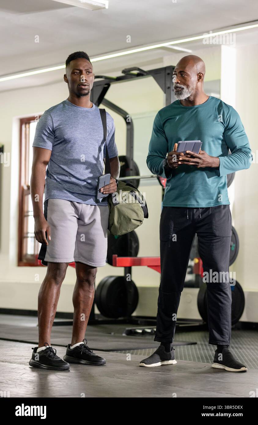 African american trainer trainee holding hi-res stock photography and ...
