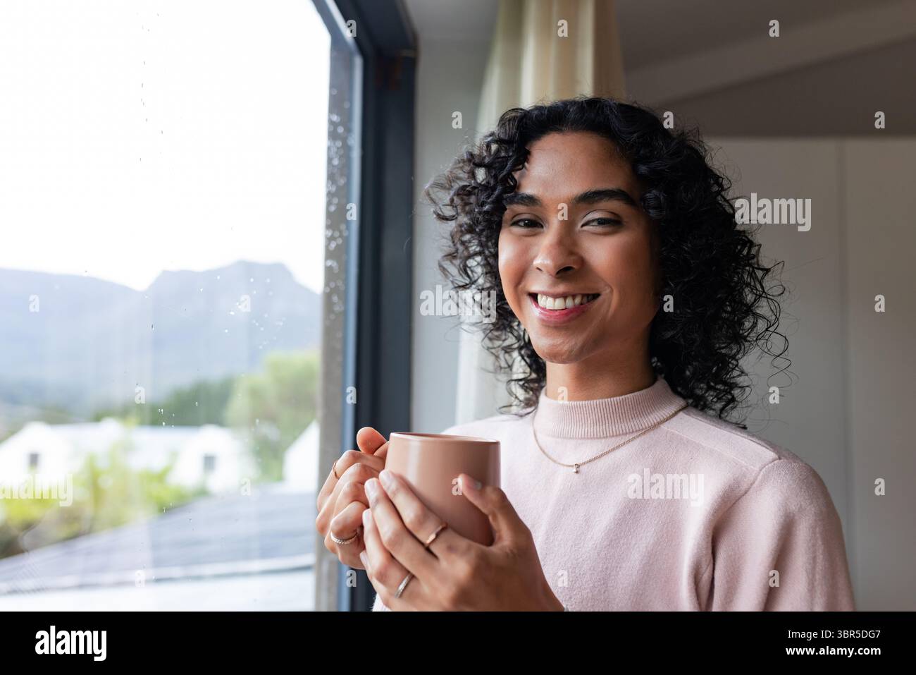 Non binary person holding mug hi-res stock photography and images - Alamy