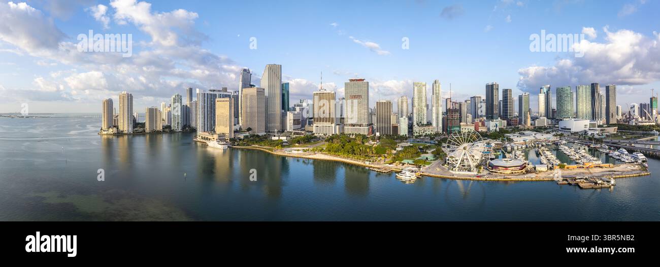 Aerial view of downtown Miami's skyline reflecting in the bay, with the ...