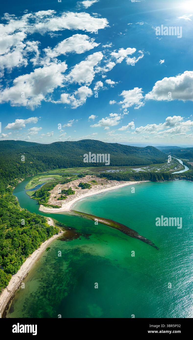 Aerial view of the picturesque curves of a river among lush vegetation ...