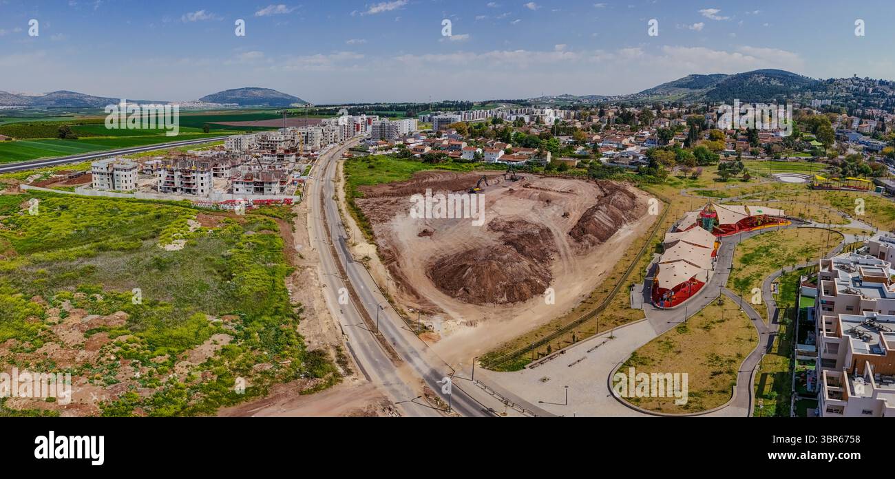 Aerial view of earthworks contrast with the modern buildings and ...