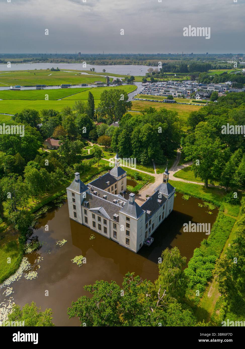 Aerial view of a historic castle surrounded by a forest, with vast ...