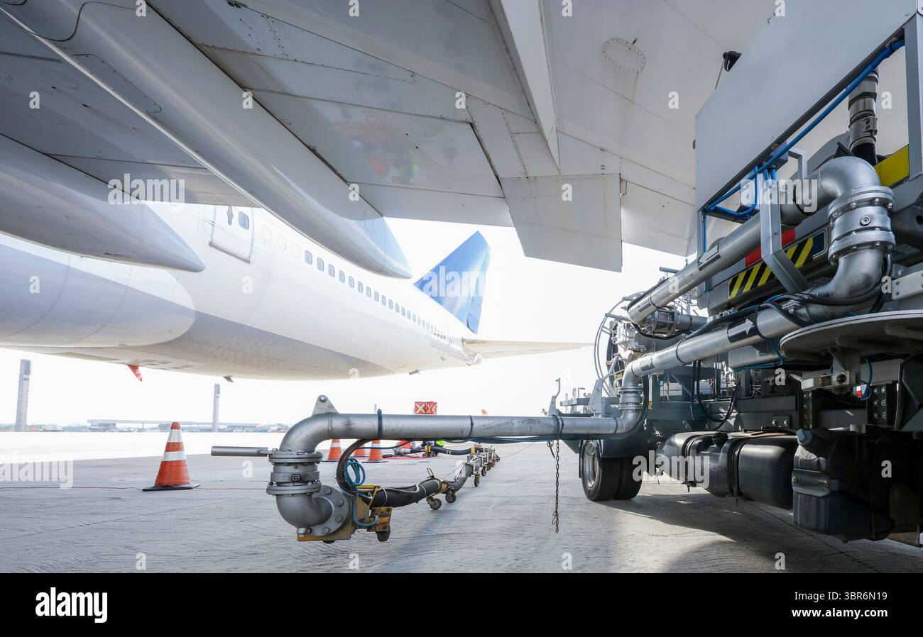 Refueling planes at the airport Stock Photo - Alamy