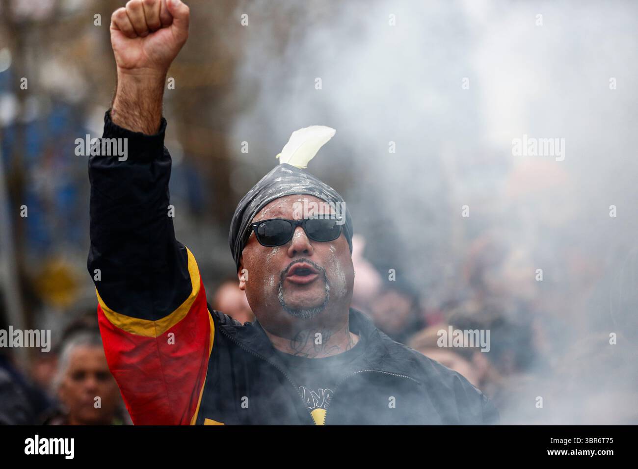A participant raises his fist during the VIC NAIDOC March. The 2025 ...