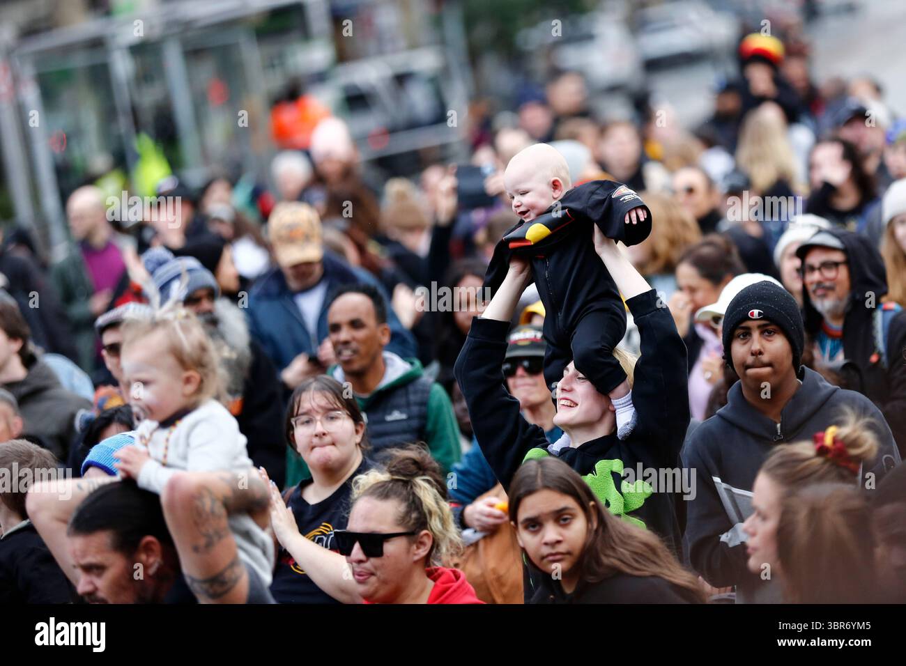 People holding flags participate in the annual Victorian NAIDOC march ...