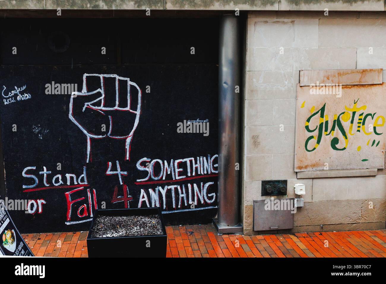 hand painted protest signs on city walls Stock Photo - Alamy