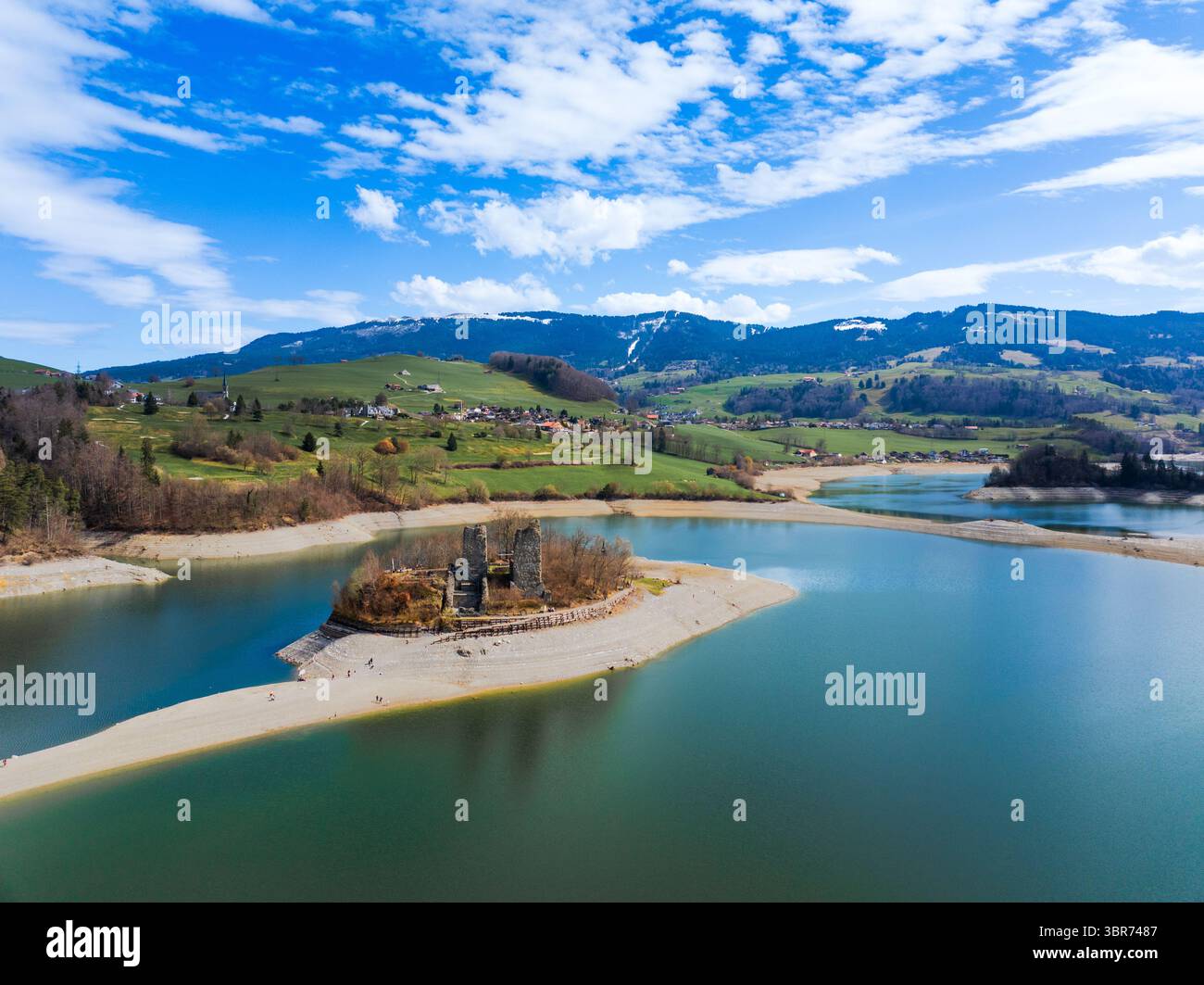 Aerial view of a medieval castle ruin standing proudly on an island ...