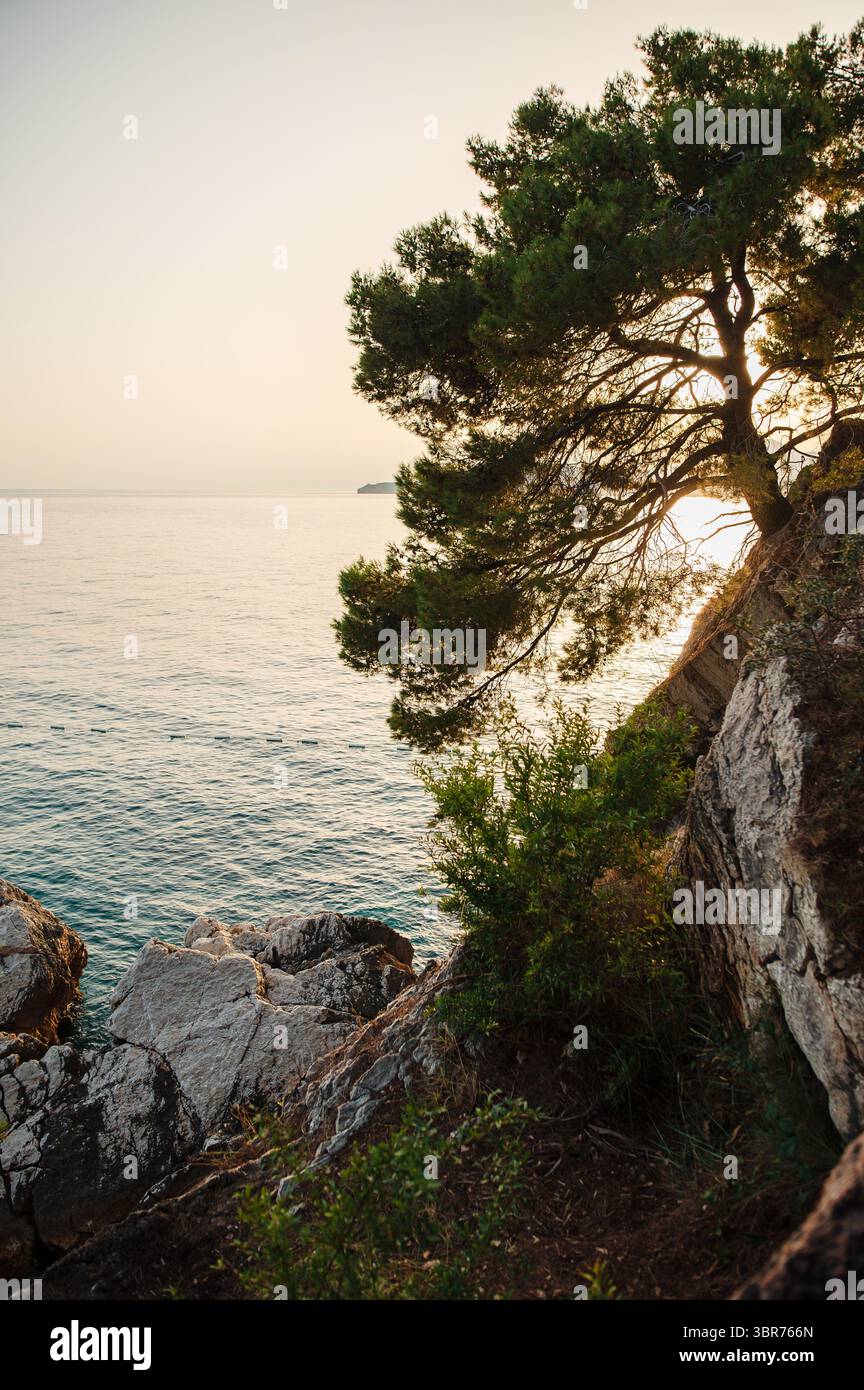 Sunset over rocky coastline hi-res stock photography and images - Alamy