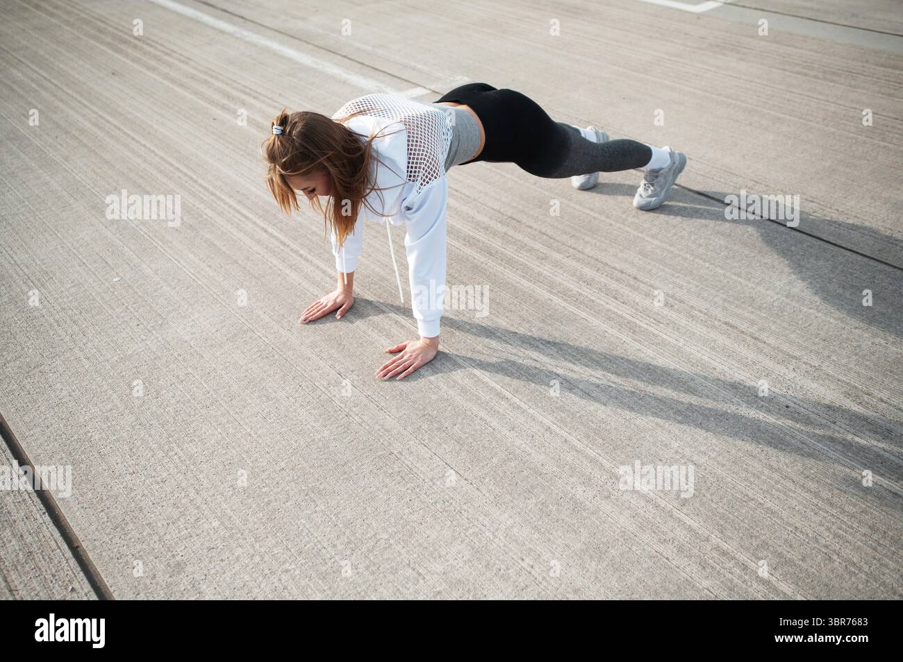 Woman Performing Plank Exercise Outdoors Stock Photo - Alamy