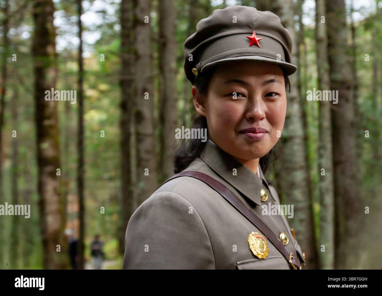 Portrait of a North Korean guide in military style uniform, Ryanggang ...