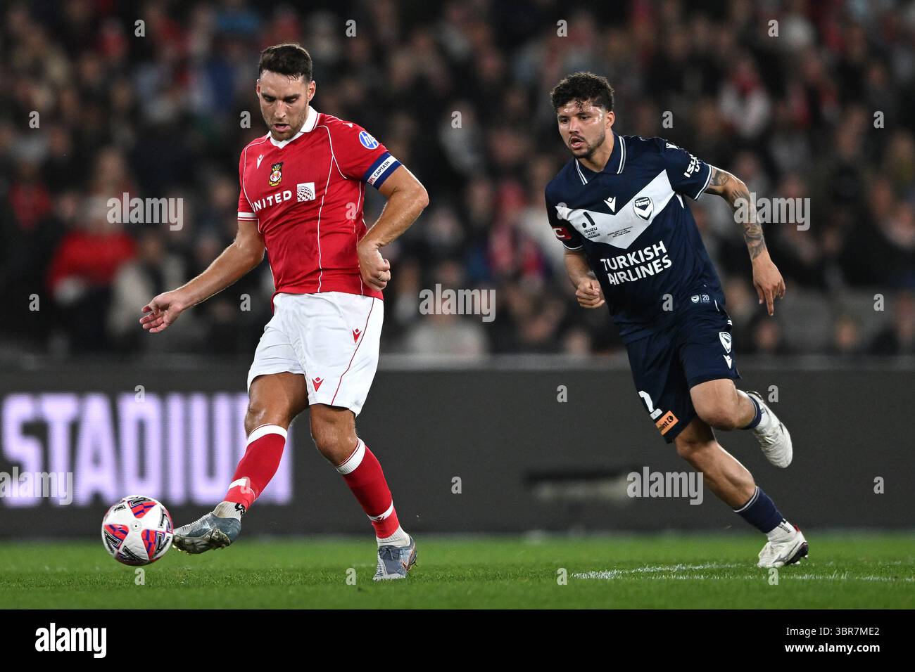 Matty James of Wrexham (left) kicks the ball during the Soccer match ...