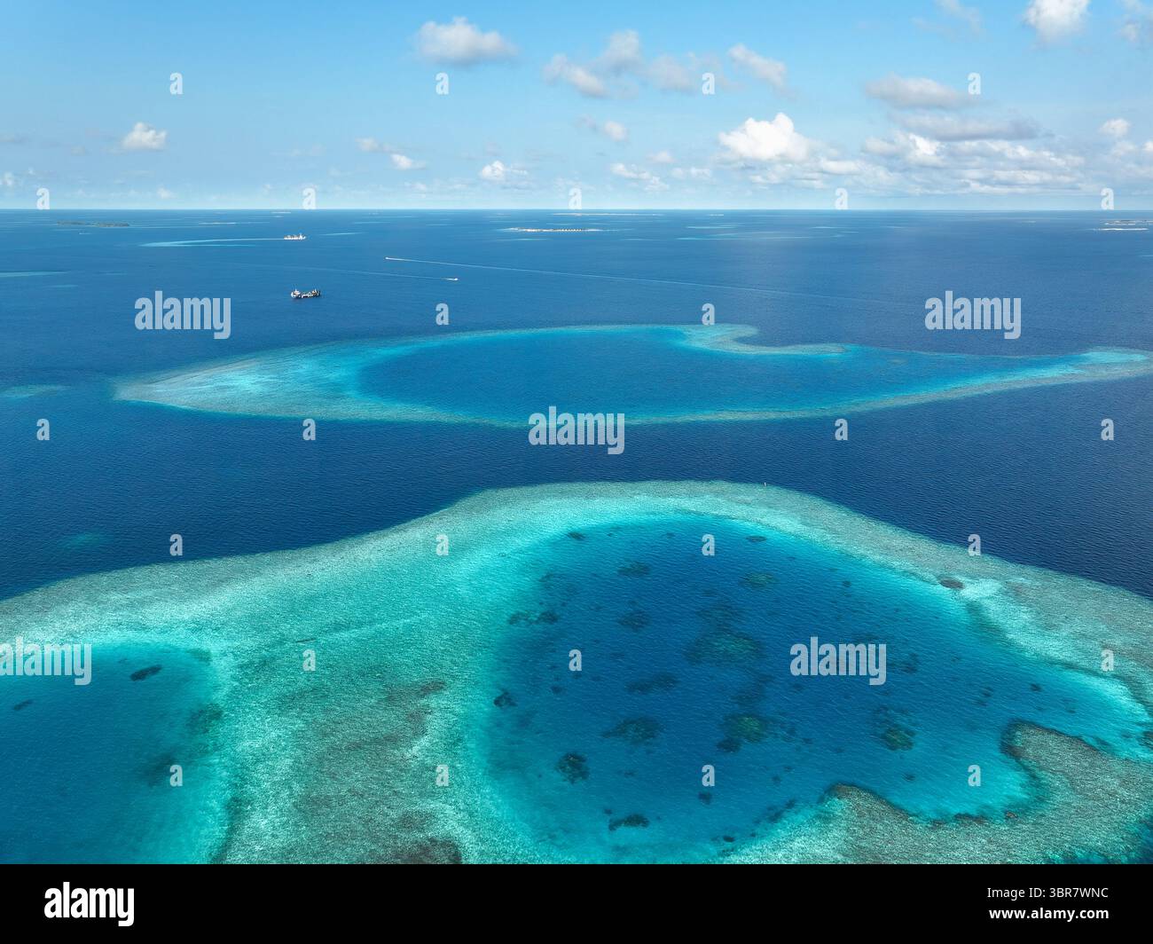 Aerial view of mesmerizing turquoise waters embracing coral reefs, a ...