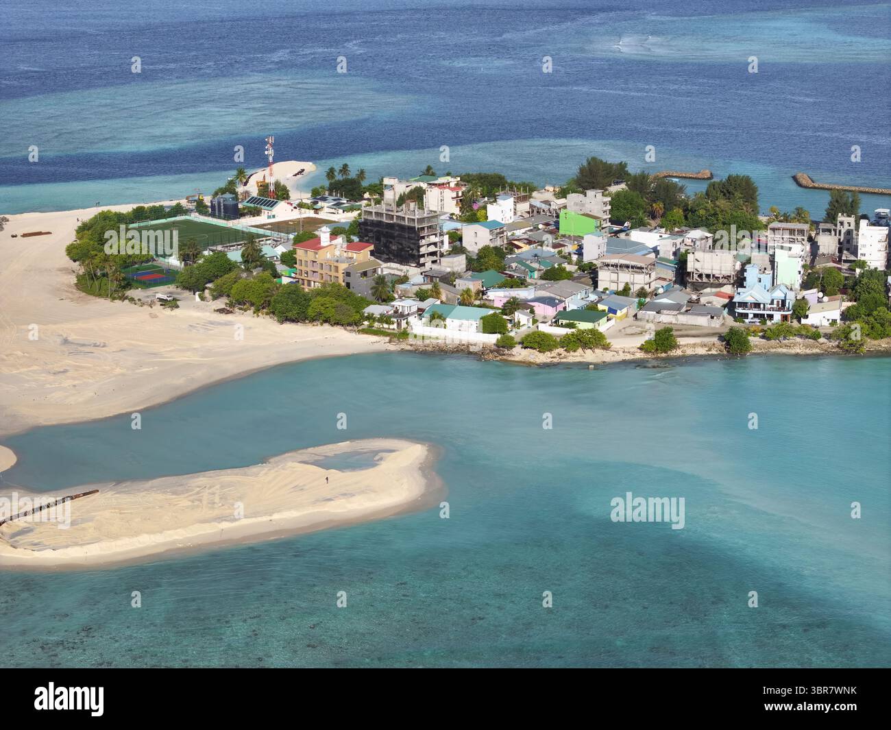Aerial view of serene turquoise waters embrace the sandy shores of ...