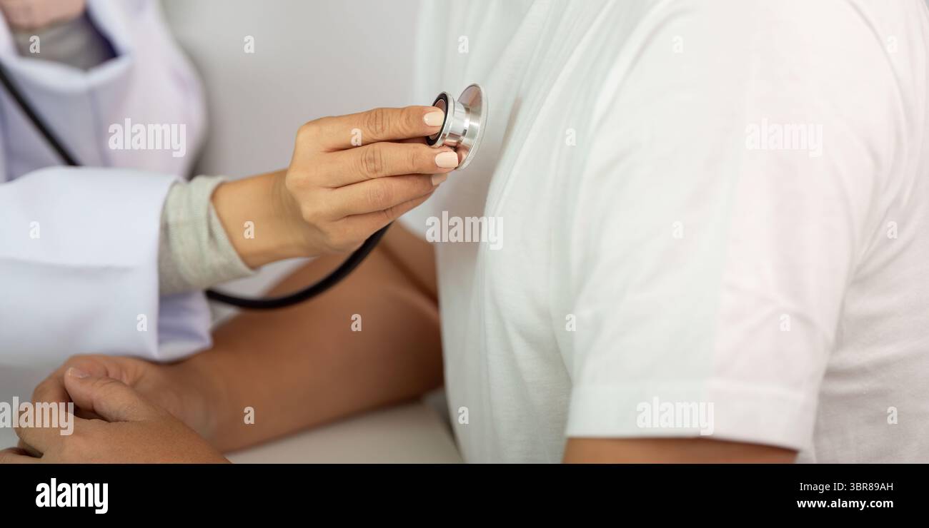 Healthcare. Doctor using stethoscope for patient examination Stock ...