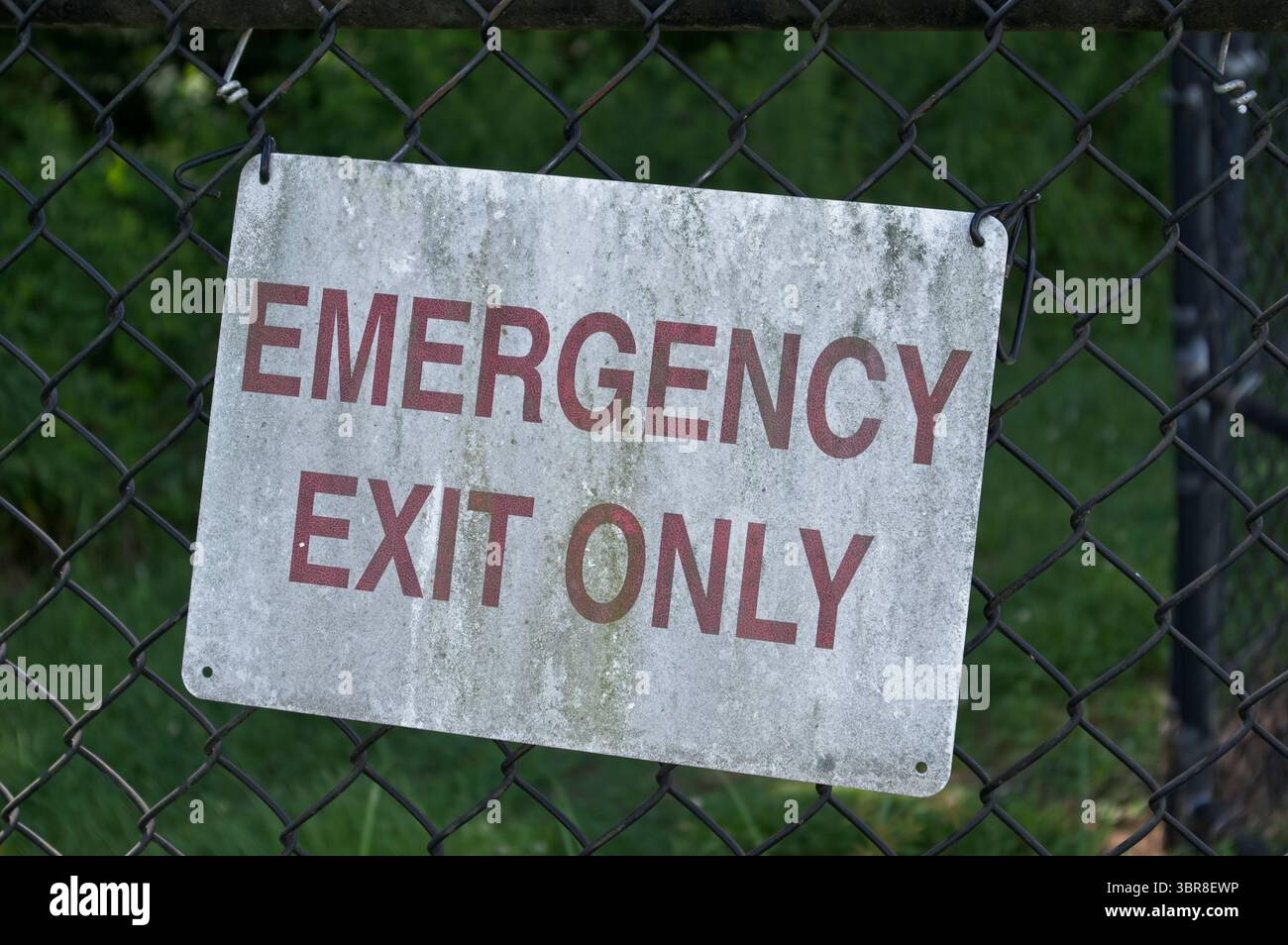 Dirty sign for Emergency Exit Stock Photo - Alamy