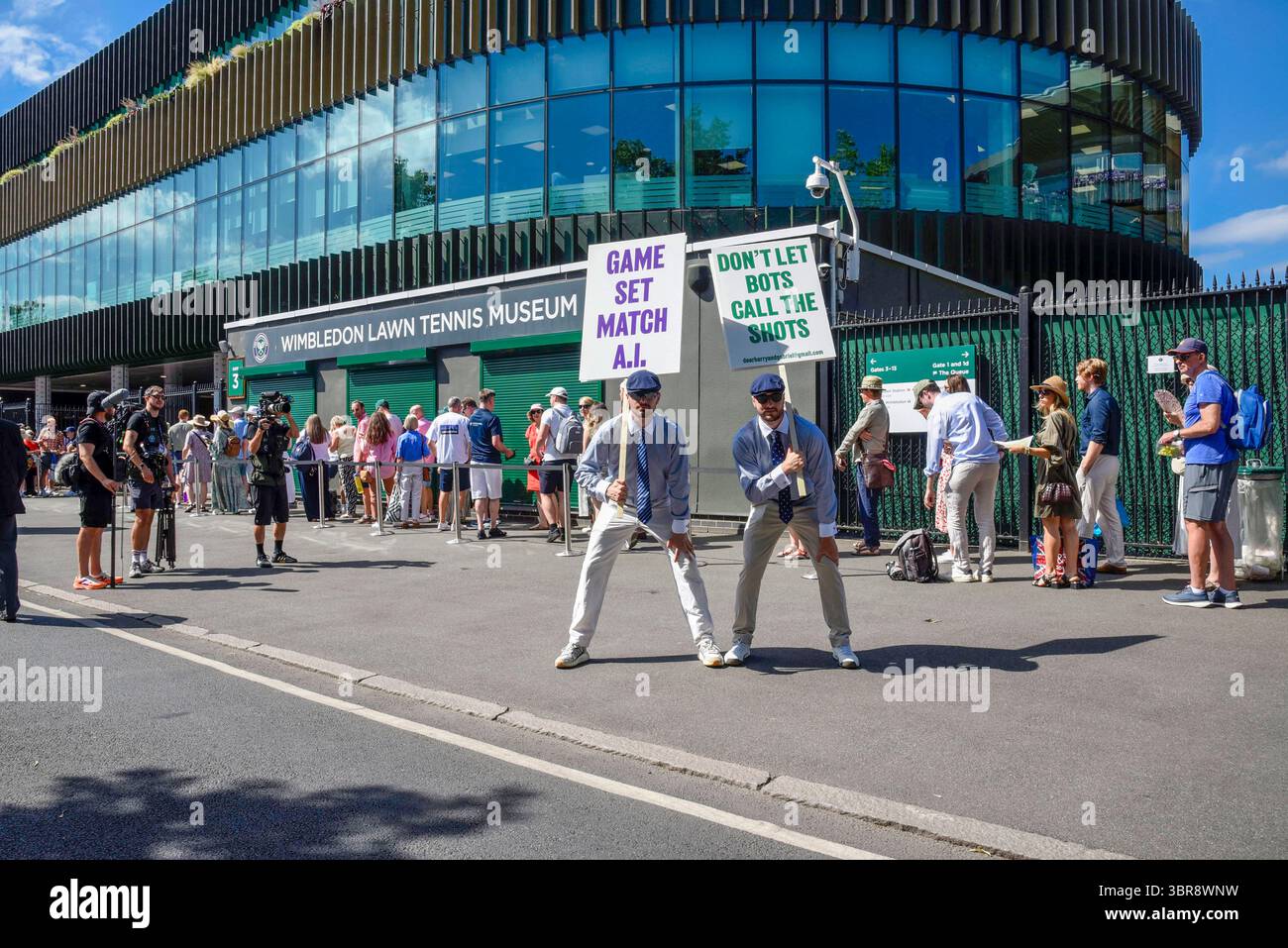 Two men dressed as tennis line judges stage a demonstration outside ...