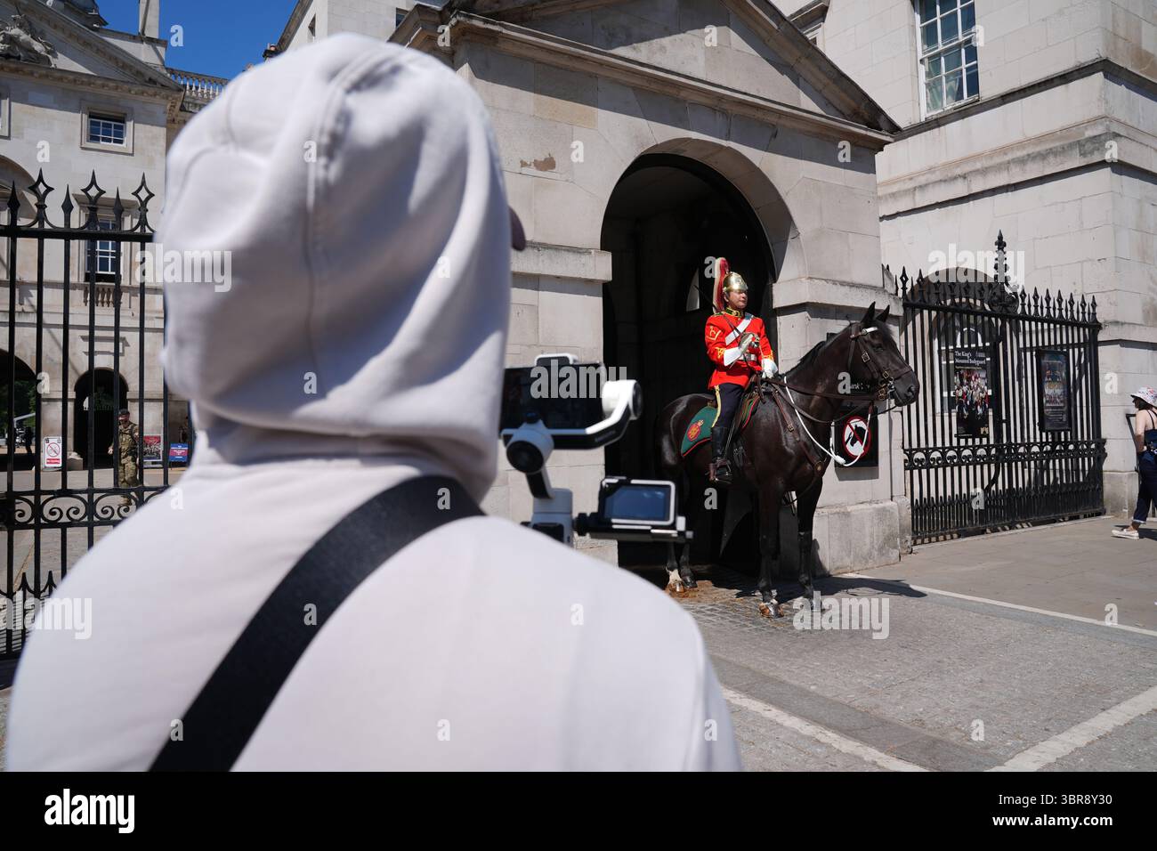 A tourist films a member of the Canadian regiment, Lord Strathcona's ...