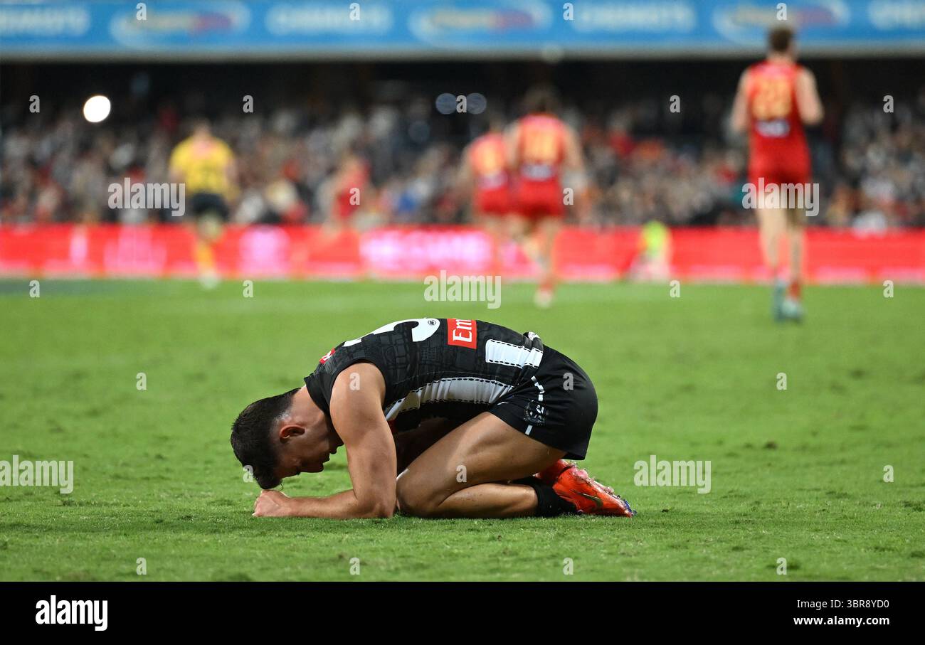 Nick Daicos of the Magpies recovers during the AFL Round 18 match ...