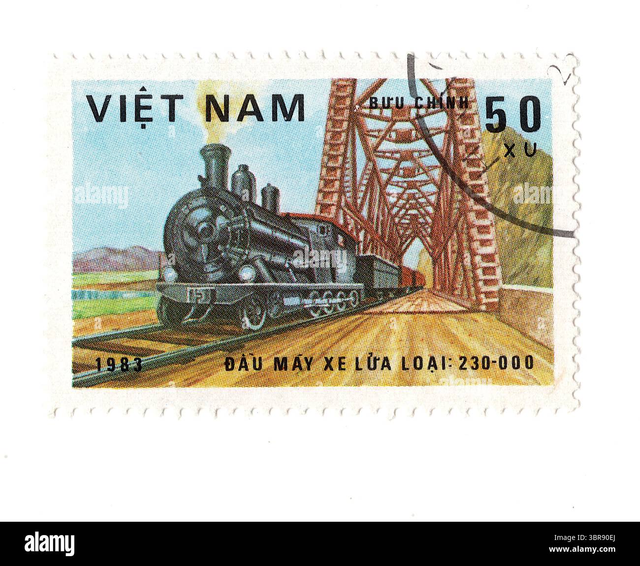 A vintage steam train postage stamp from Vietnam isolated on a white ...
