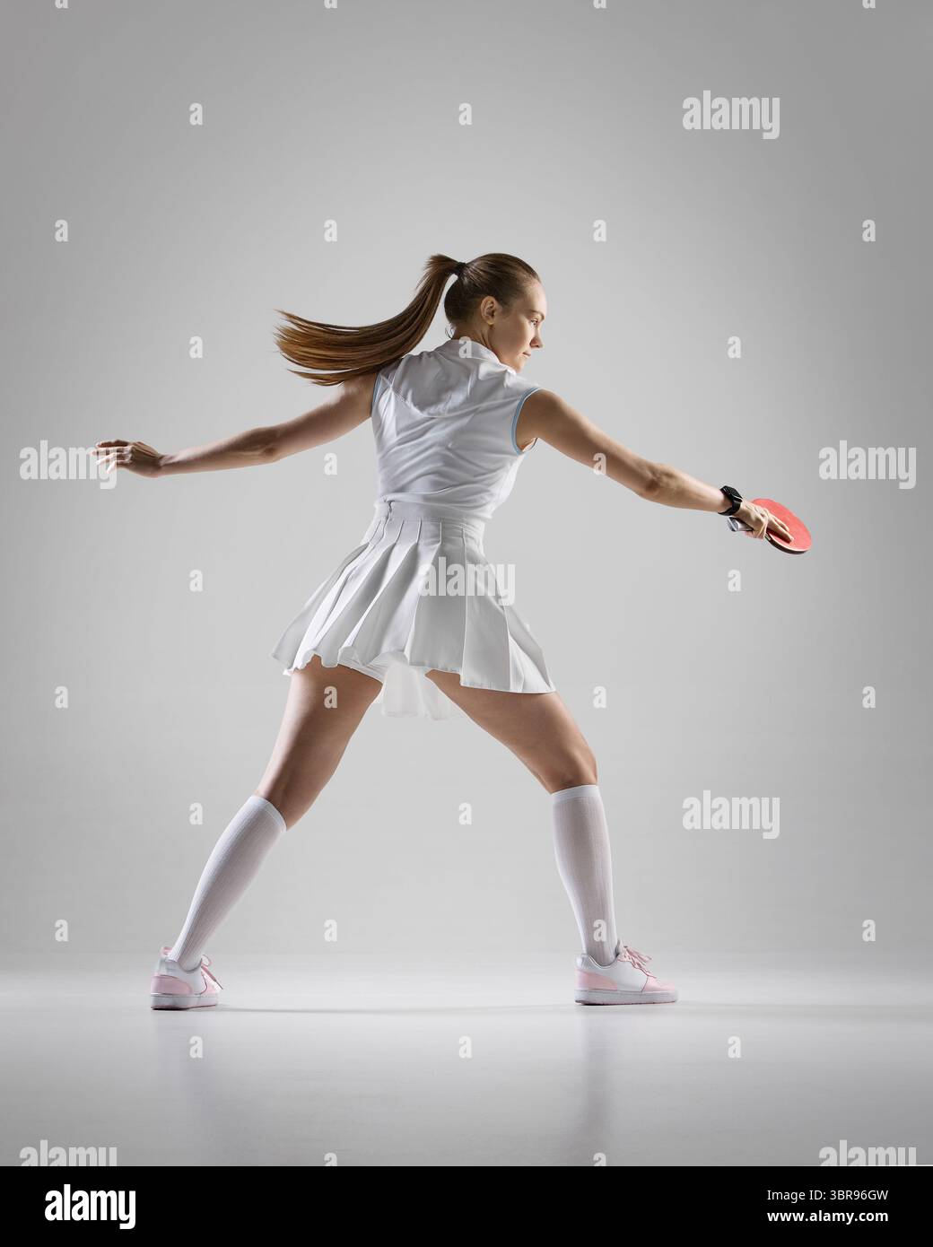 Female athlete playing table tennis with intensity and style Stock ...