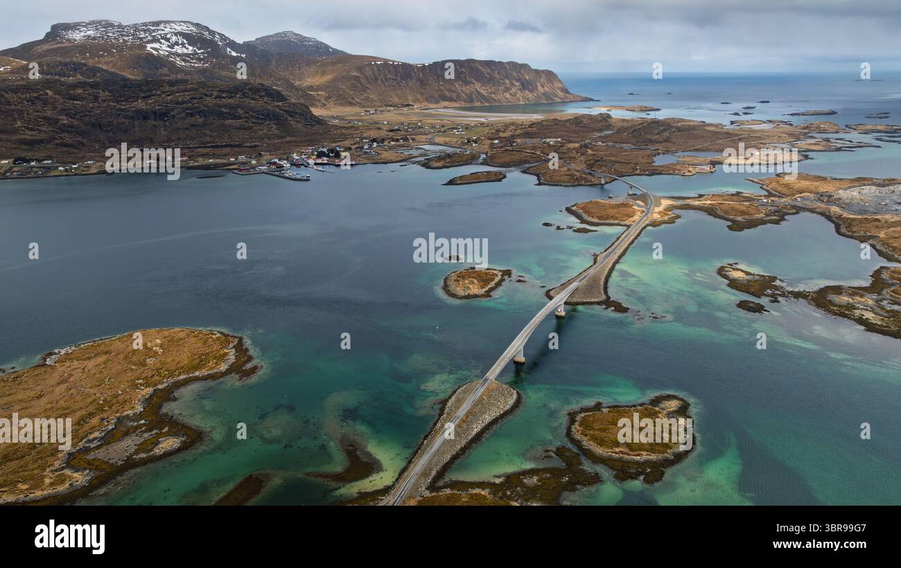 Aerial view of bridge stretching across turquoise waters dotted with ...