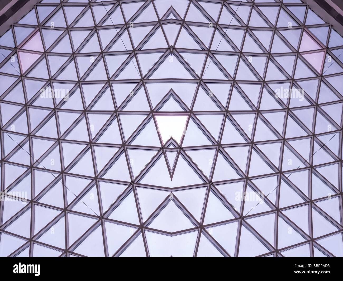 Architectural glass structure with a geometric triangular pattern ...