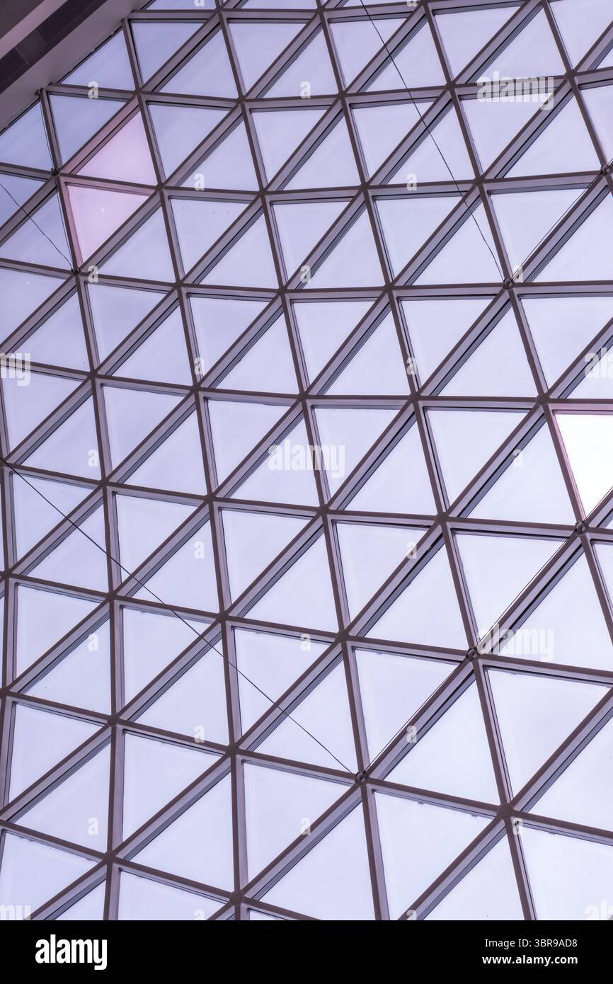 Architectural glass structure with a geometric triangular pattern ...