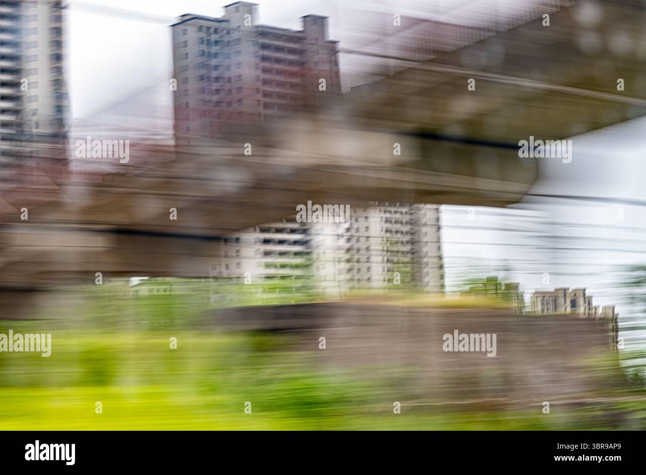 Dynamic motion blur view from high-speed train window: Green landscape ...