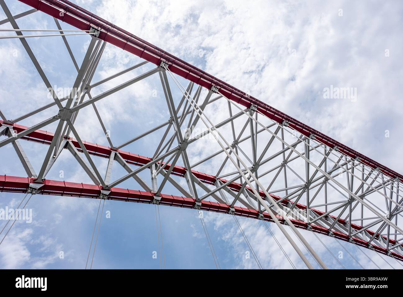steel beams is bolted down. Close-up shows the connection of the metal ...