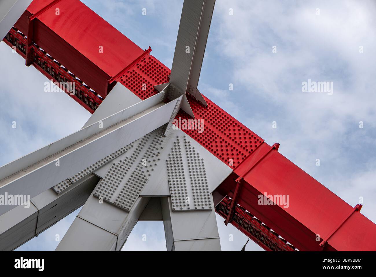 steel beams is bolted down. Close-up shows the connection of the metal ...