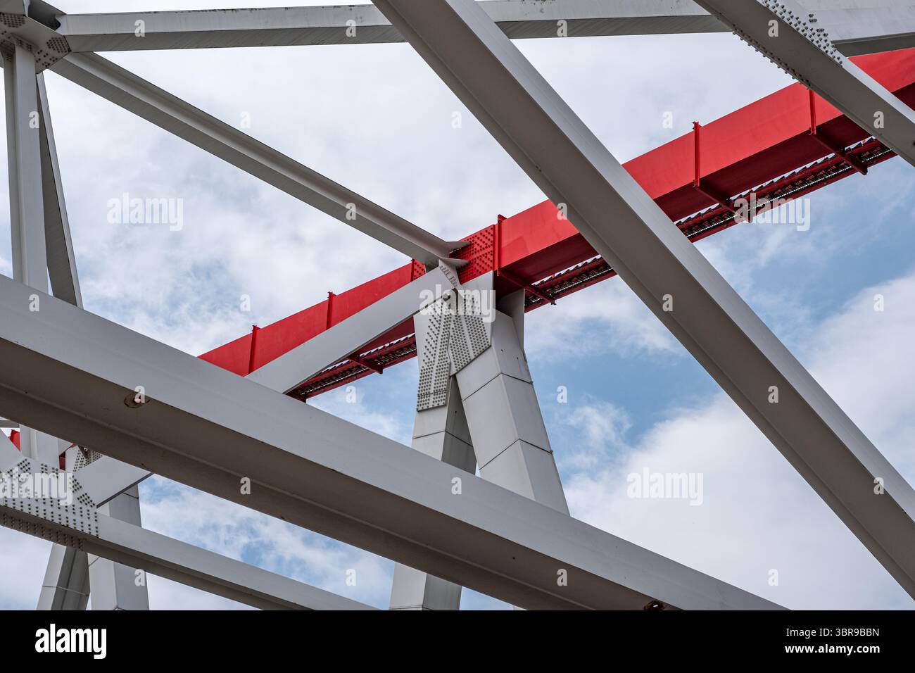 steel beams is bolted down. Close-up shows the connection of the metal ...