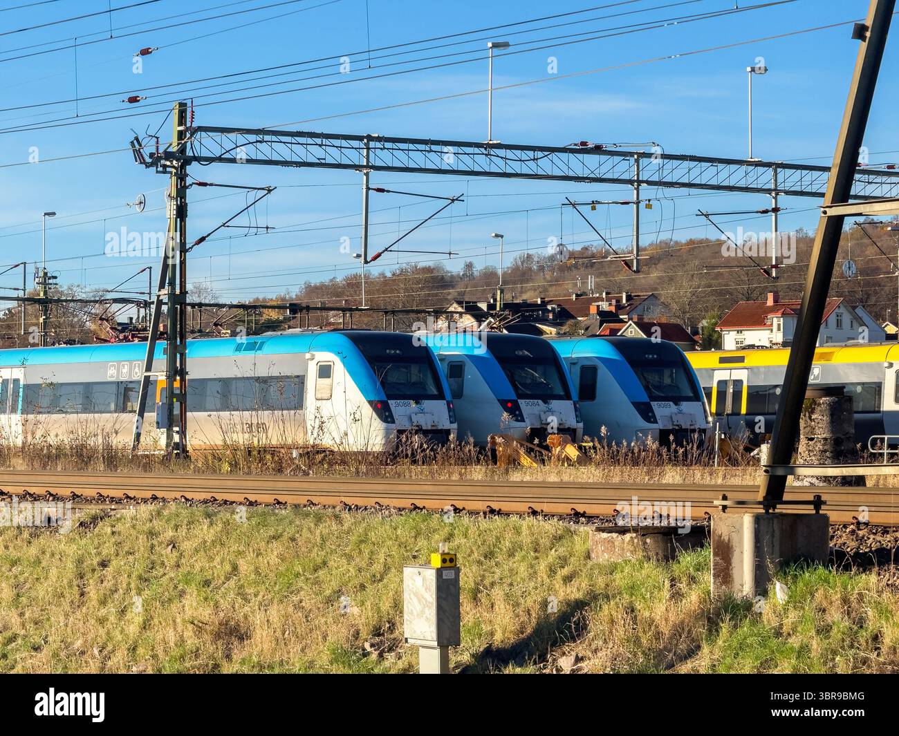 Commuter trains on a railroad yard Stock Photo - Alamy