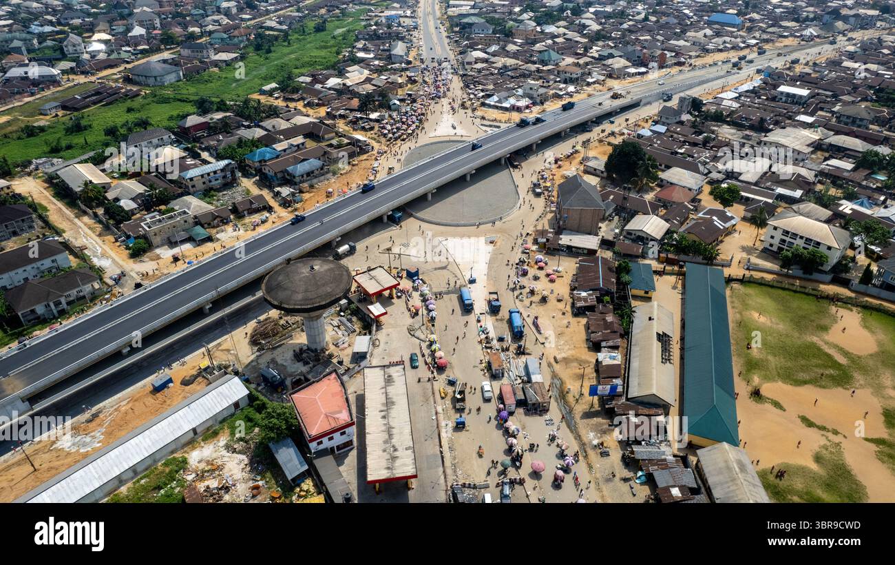 Aerial view of a bustling urban intersection with a modern overpass ...