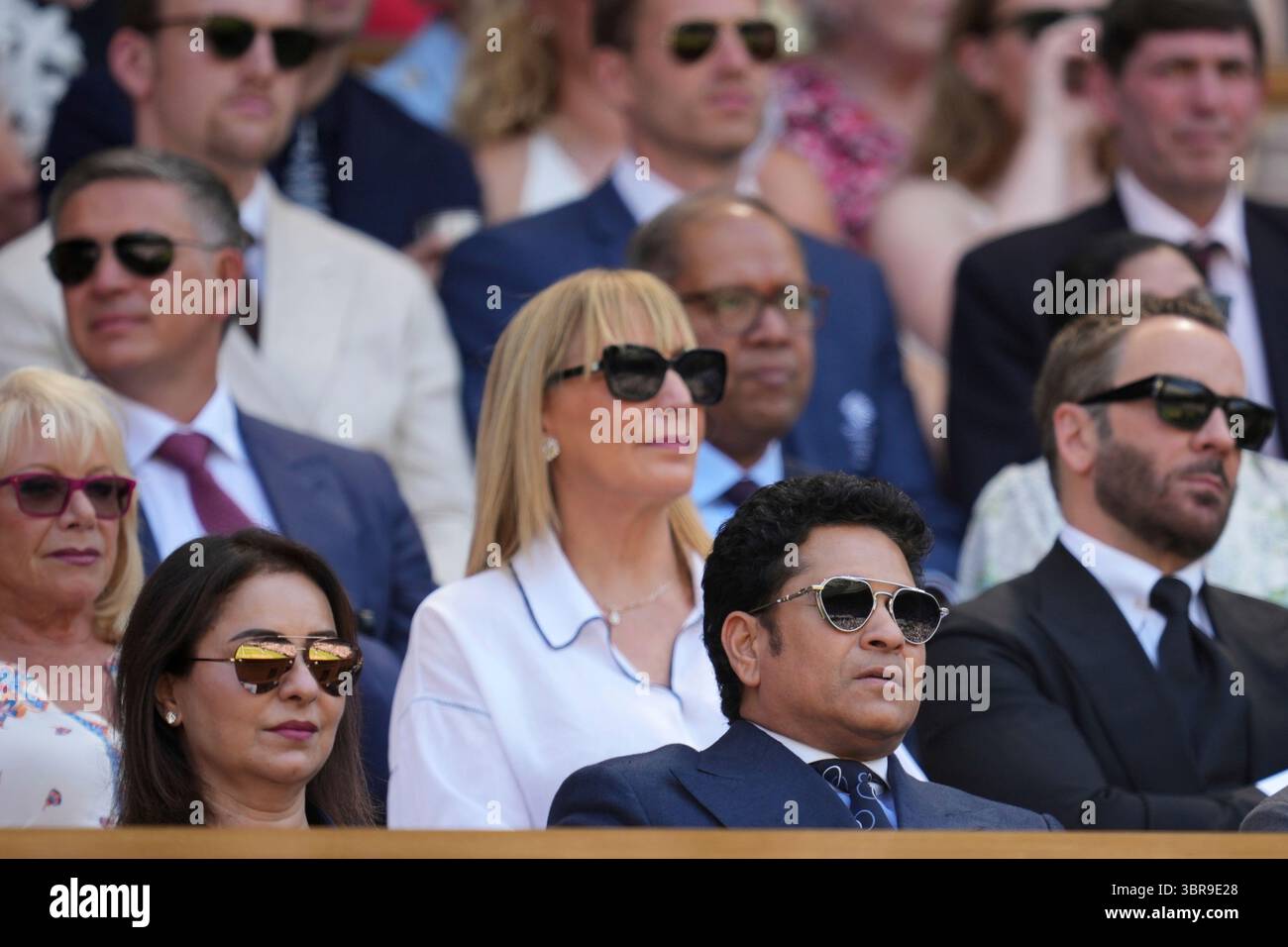Indian cricket legend, Sachin Tendulkar with his wife Anjali sit in the ...