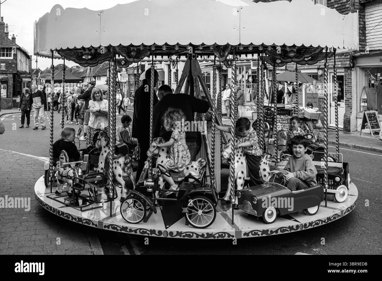 Local Children Riding On A Traditional Carousel At The Steyning Country ...