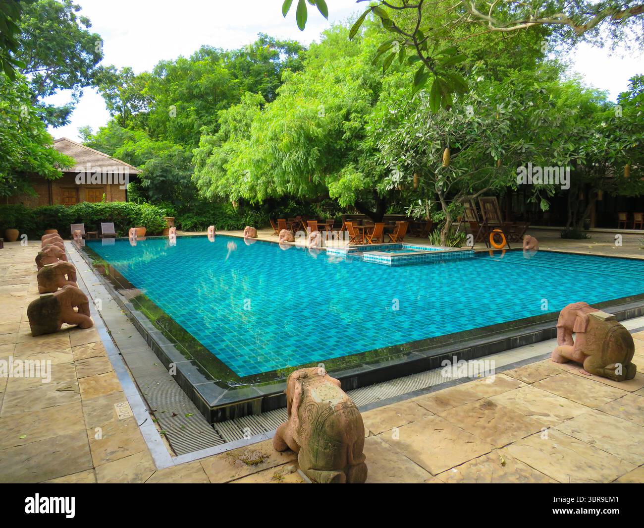 A Blue swimming pool in Southeast Asia Stock Photo - Alamy