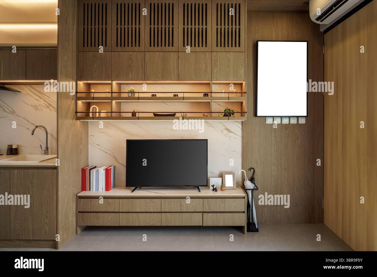 Japandi style living room with a TV console, marble wall, and built-in ...