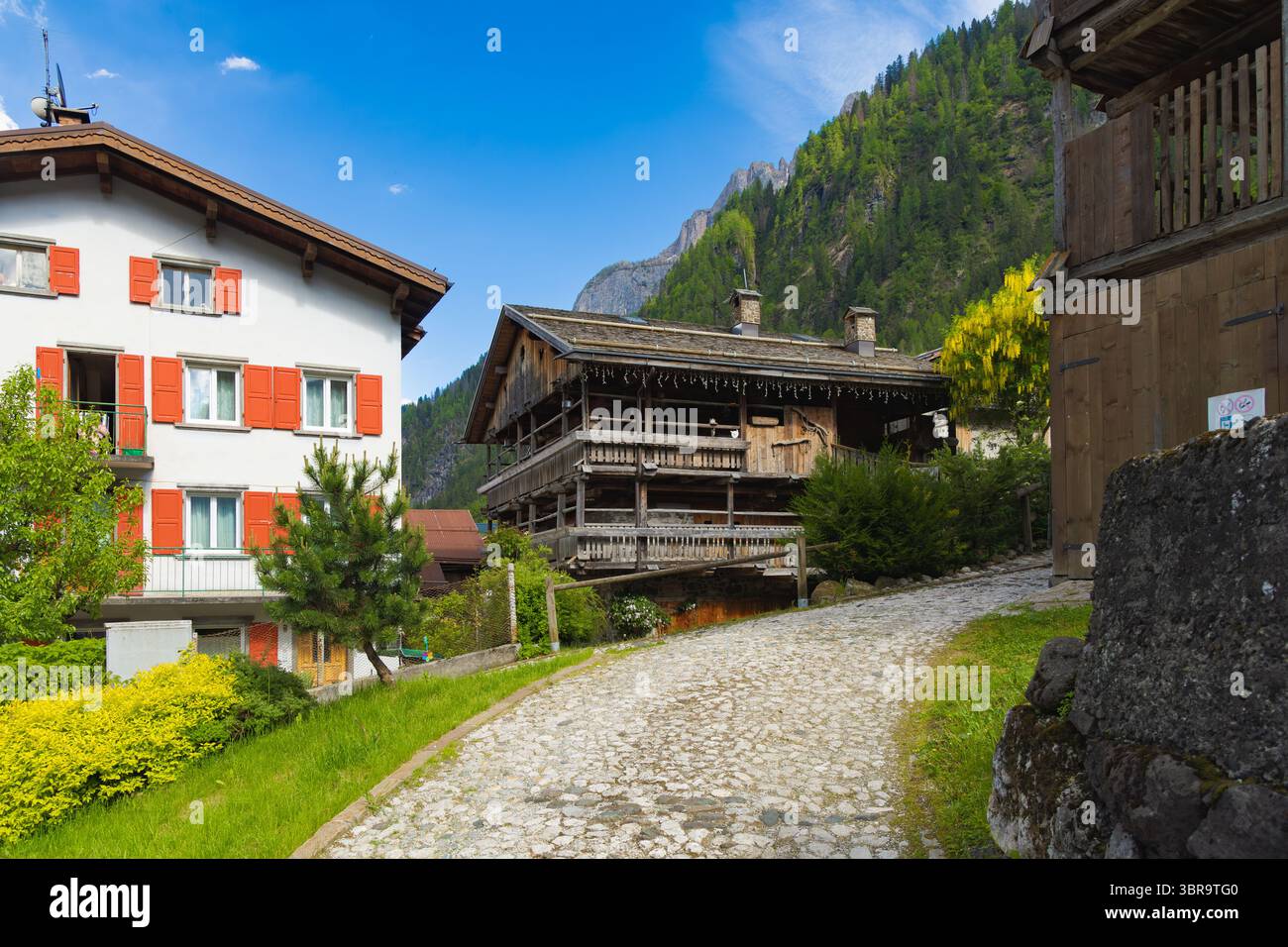 A charming cobblestone street in Sottoguda, a traditional Alpine ...