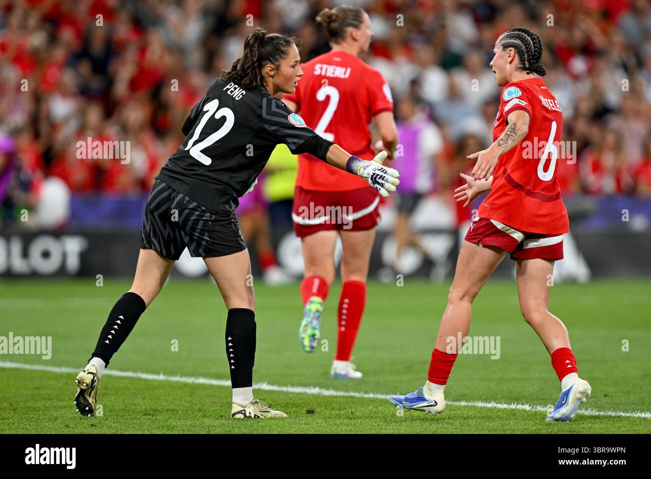 goalkeeper Livia Peng (12) of Switzerland and Geraldine Reuteler (6) of ...