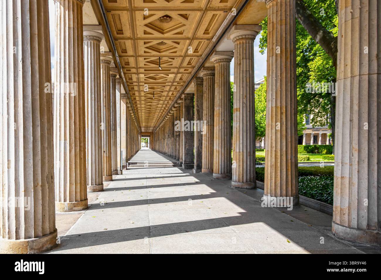 Historic colonnade with classical stone pillars. Symmetrical view of an ...