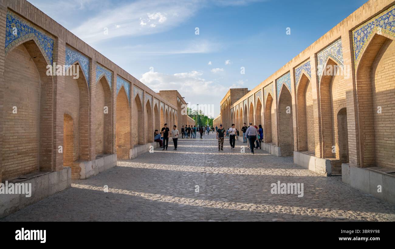 Isfahan, Iran - 14 May 2019: People walk over Si-o-se-pol, the 17th ...