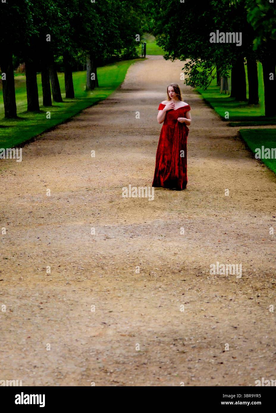 Thoughtful woman stands in vibrant hi-res stock photography and images ...