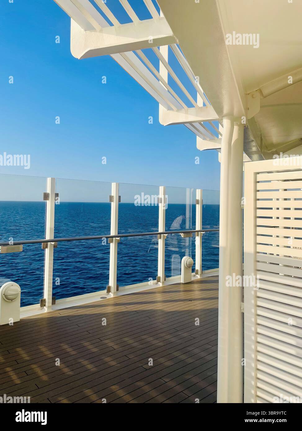 Exterior details of a modern cruise ship. Large white hull, multiple ...