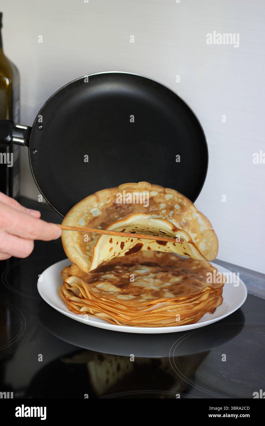 Spatula flipping pancakes in pan hi-res stock photography and images ...