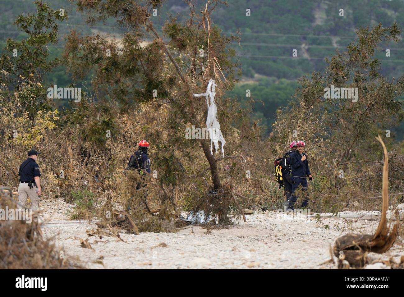 Members of Nevada Task Force One search for missing flood victims in ...
