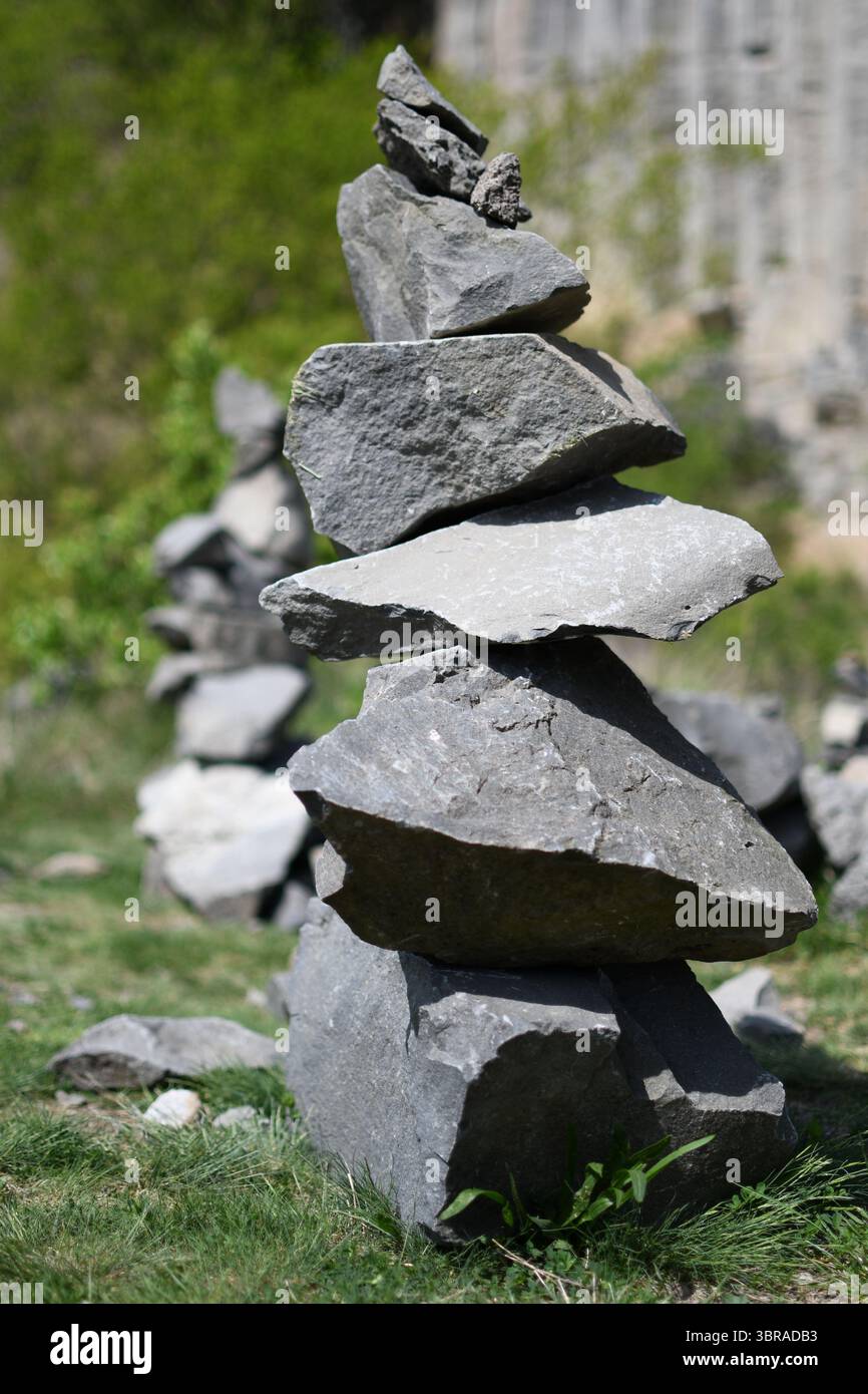 A vertical stack of rugged stones arranged carefully in nature ...