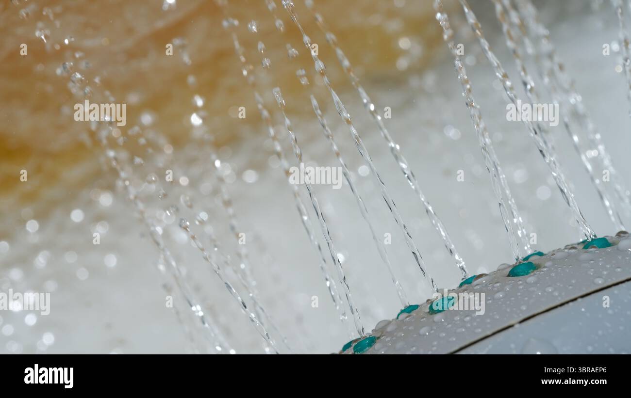 Water droplets scatter playfully around a vibrant park fountain ...