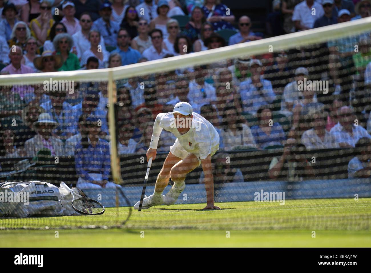 Italy's Jannik Sinner looks up after returning to Serbia's Novak ...
