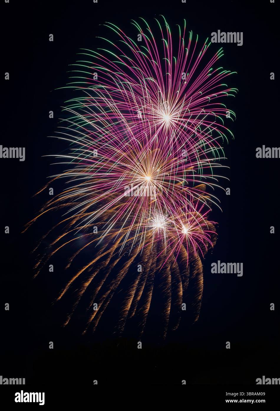 Colourful fireworks exploding in the night sky Stock Photo - Alamy
